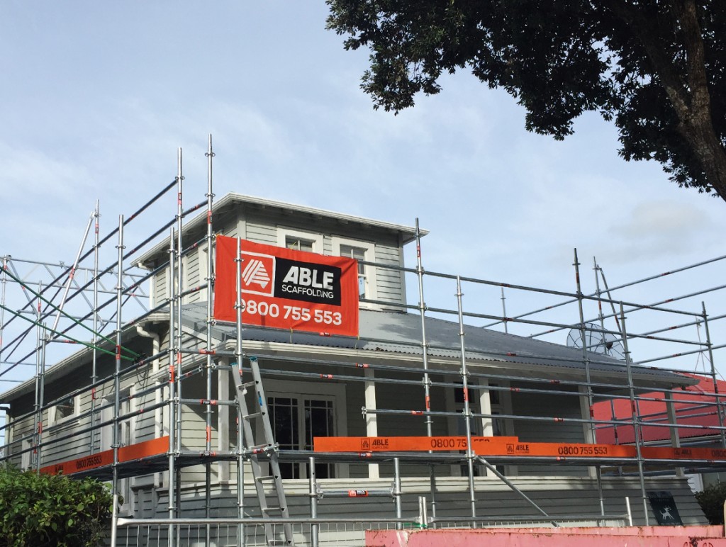 Builders extend this large home, on a tight and steeply sloping site ...